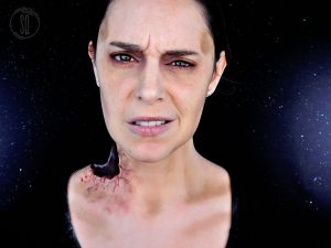 Zombie with part of neck off from a bite makeup tutorial